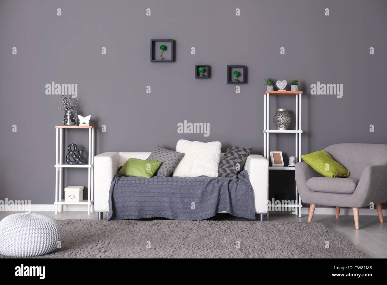 Interior of modern room with comfortable sofa Stock Photo - Alamy