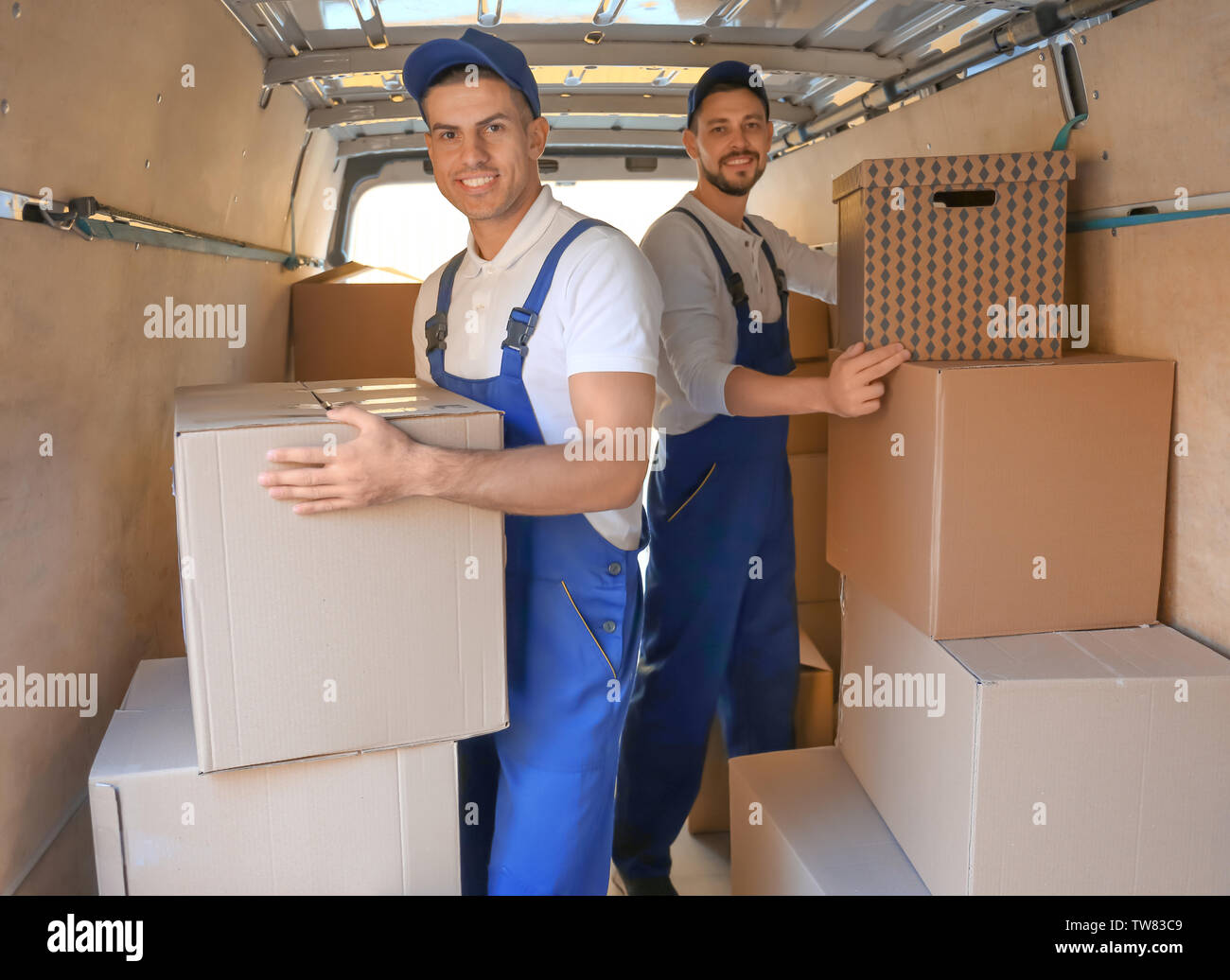 Manual worker box unloading transportation hi-res stock photography and ...