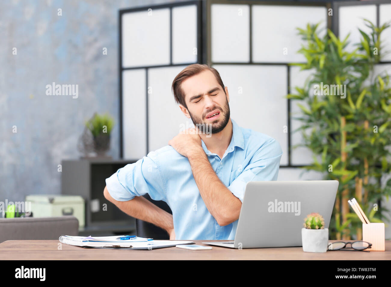 Tired young man using hi-res stock photography and images - Alamy