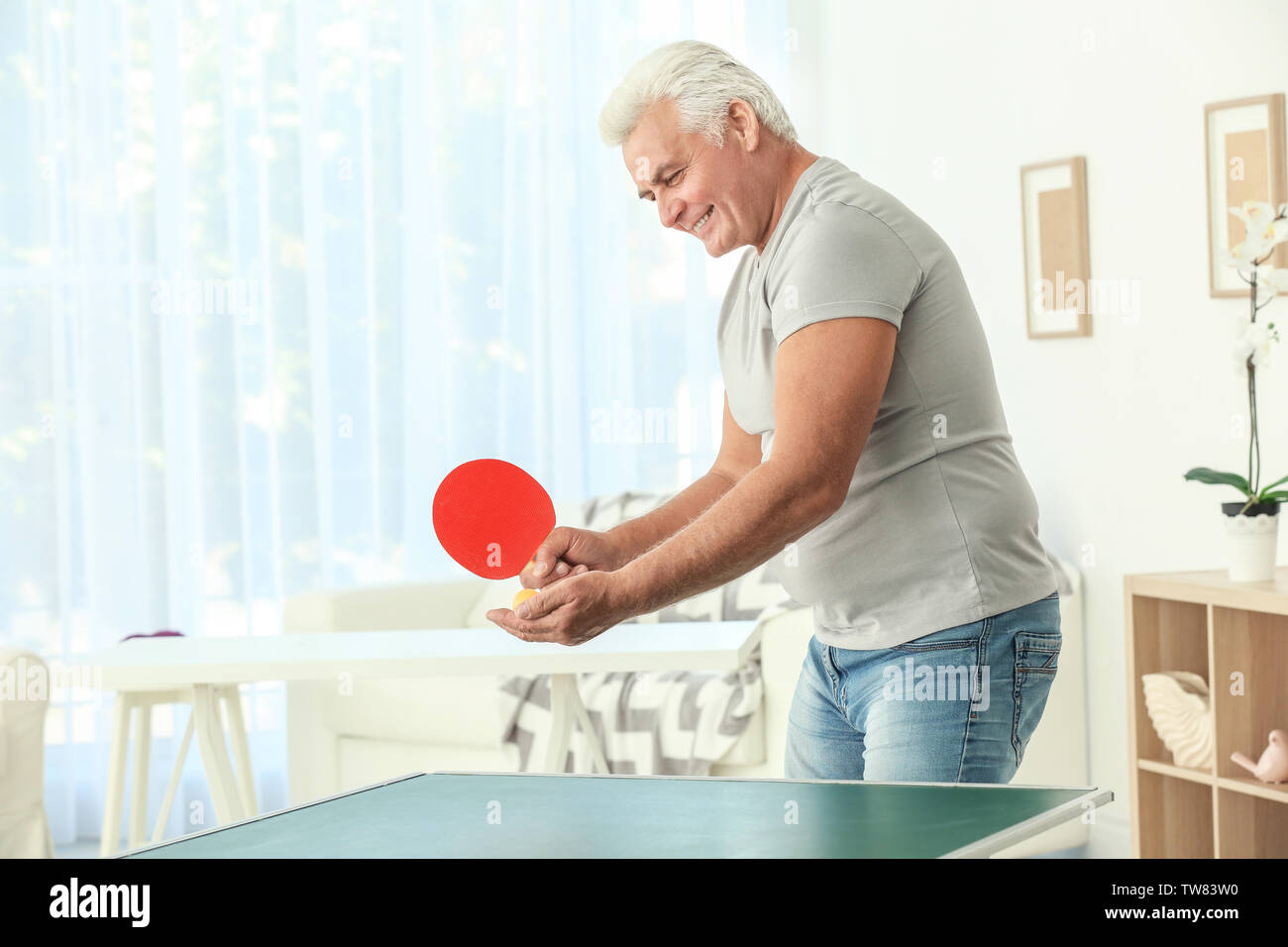 Old man table tennis hi-res stock photography and images - Alamy