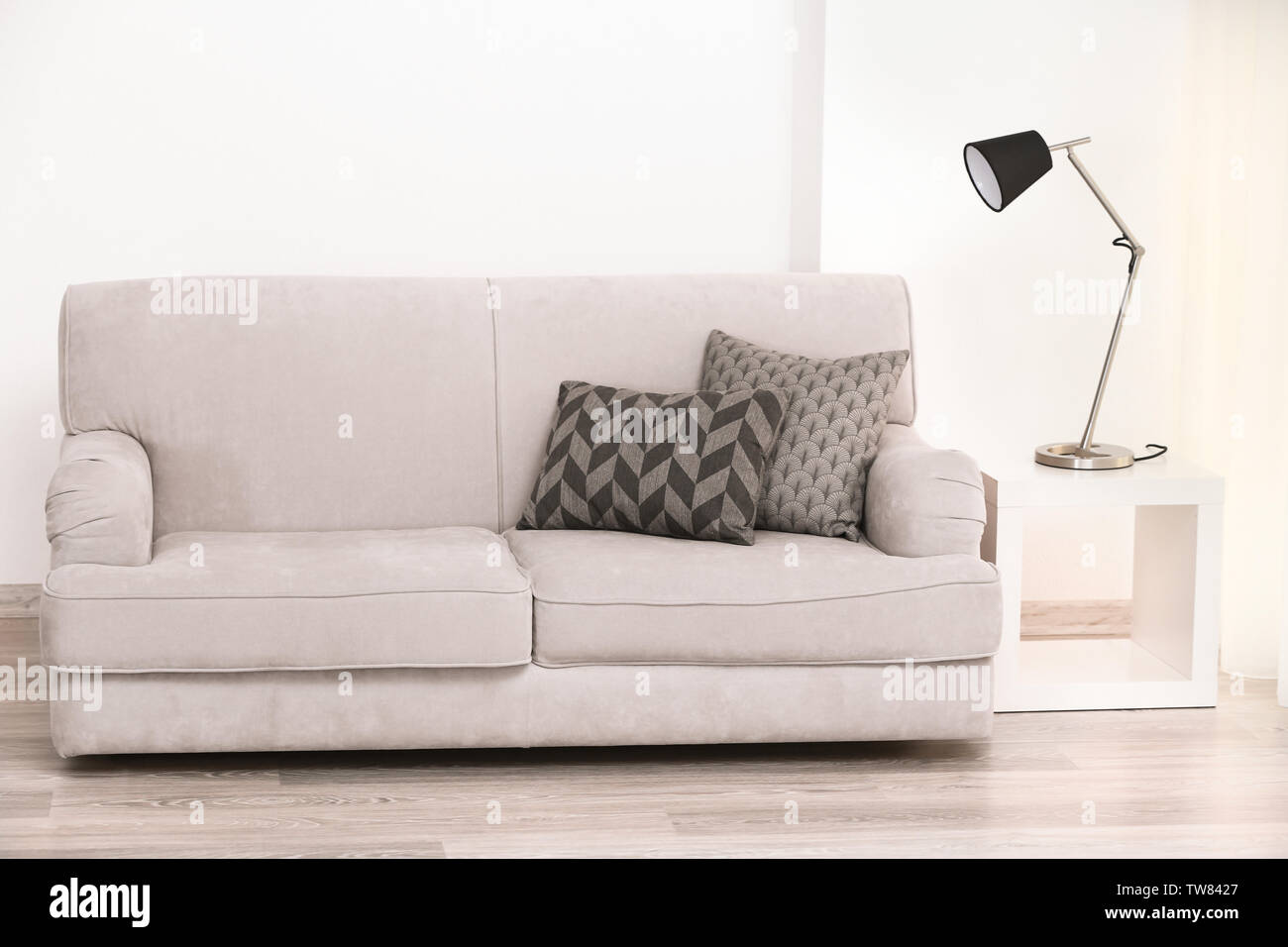 Cozy sofa in modern room Stock Photo - Alamy