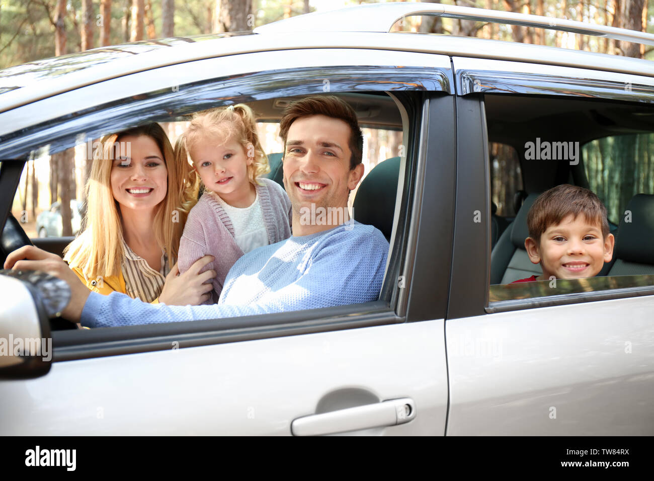 Happy family in car hi-res stock photography and images - Alamy