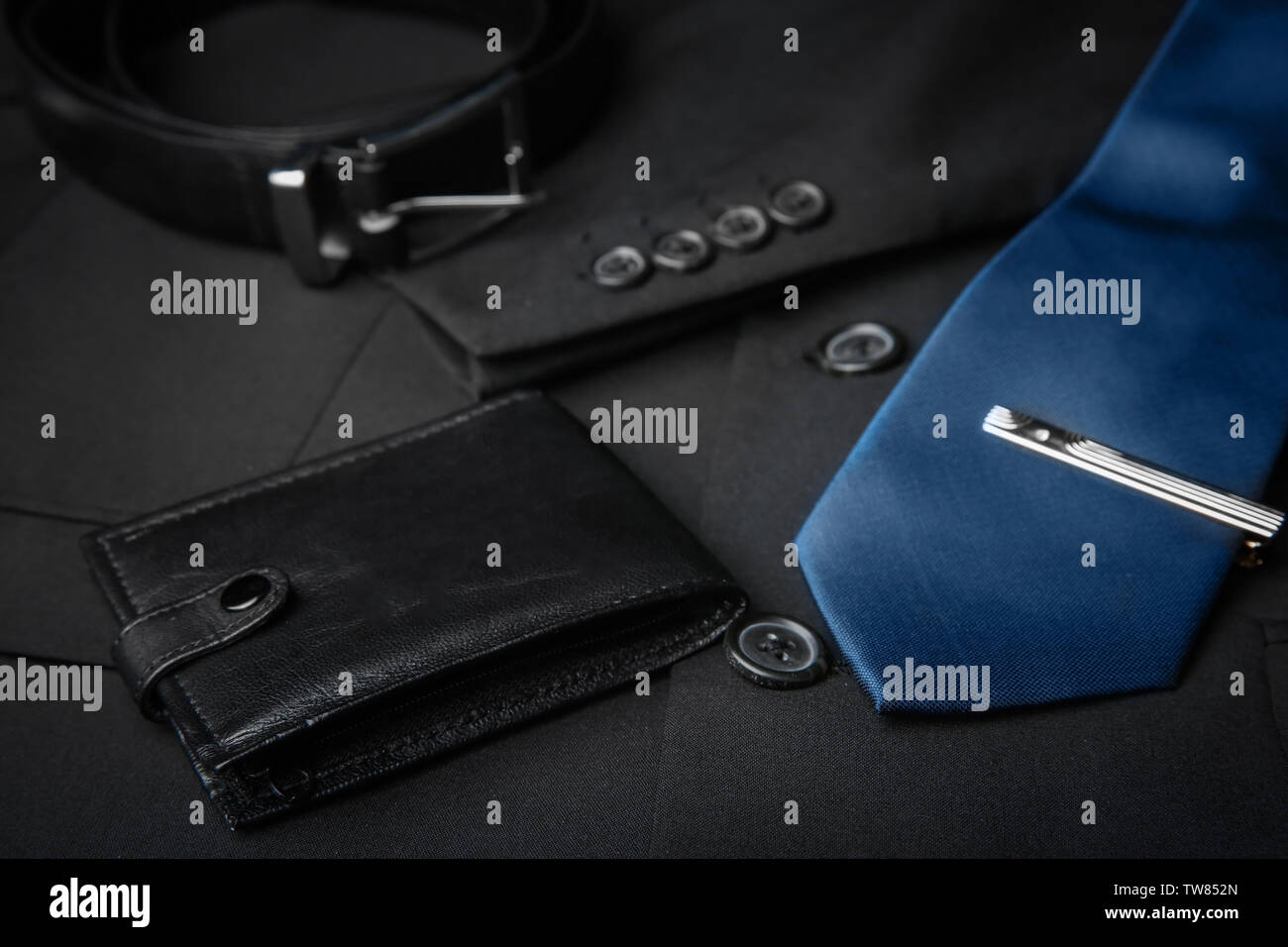 Elegant tie, wallet and belt on male jacket, closeup Stock Photo - Alamy