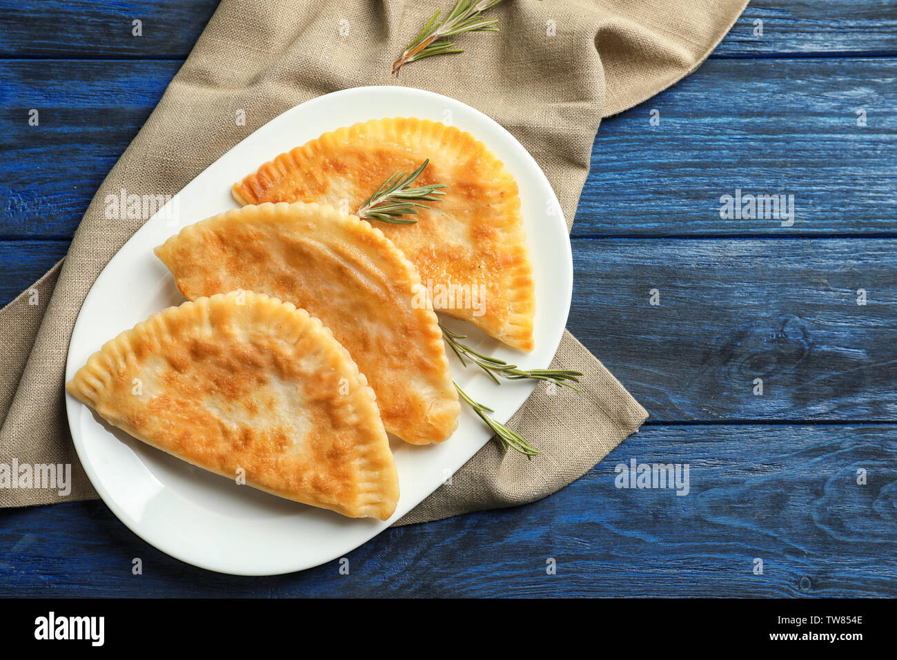 Plate with delicious deep fried samosas on table Stock Photo - Alamy