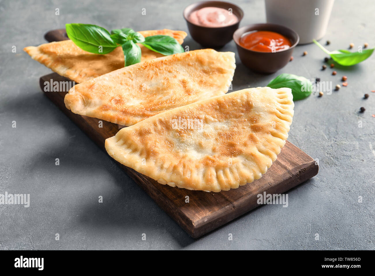 Wooden board with deep fried samosas on grey background Stock Photo - Alamy