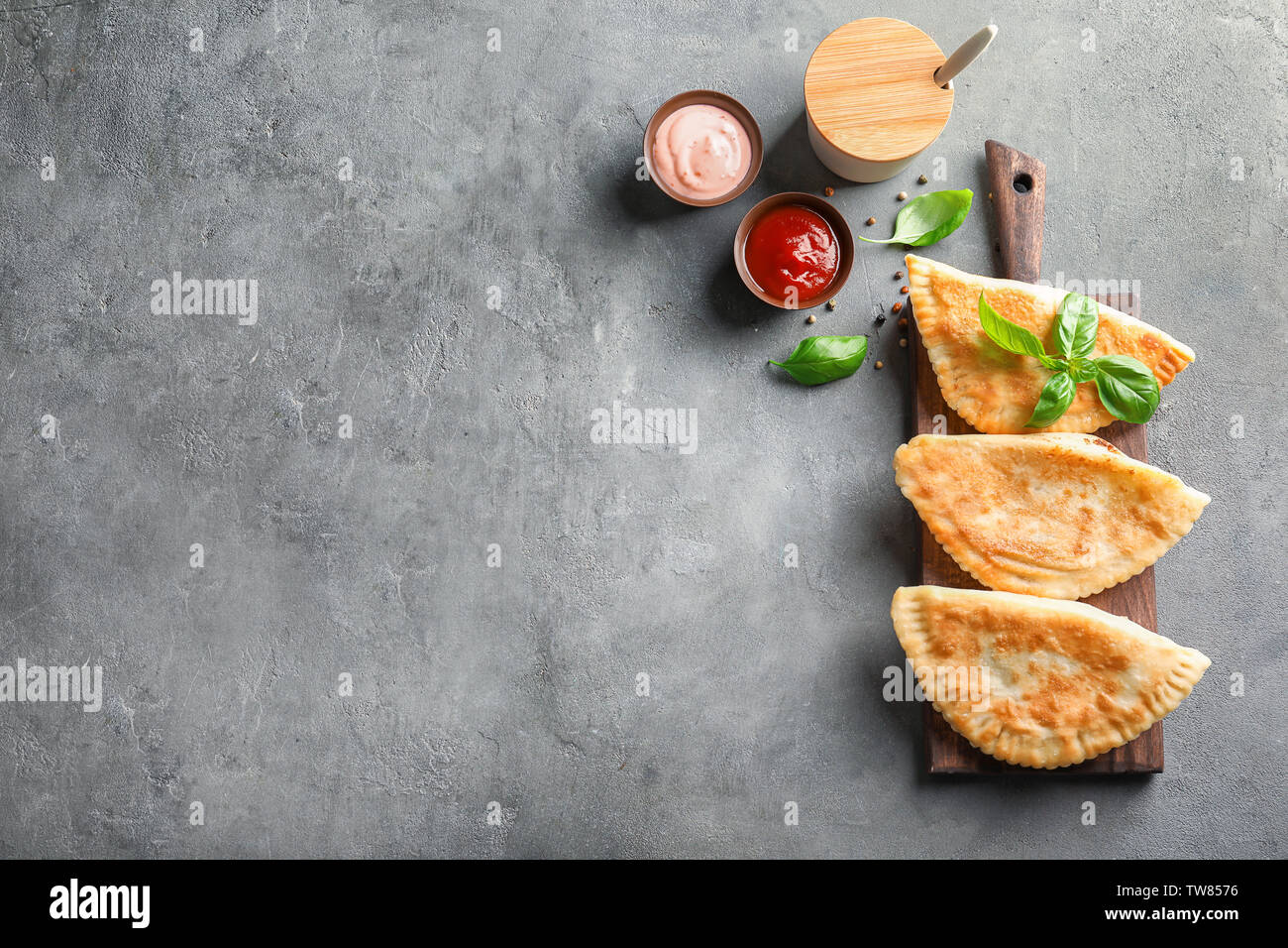 Wooden board with deep fried samosas on grey background Stock Photo - Alamy
