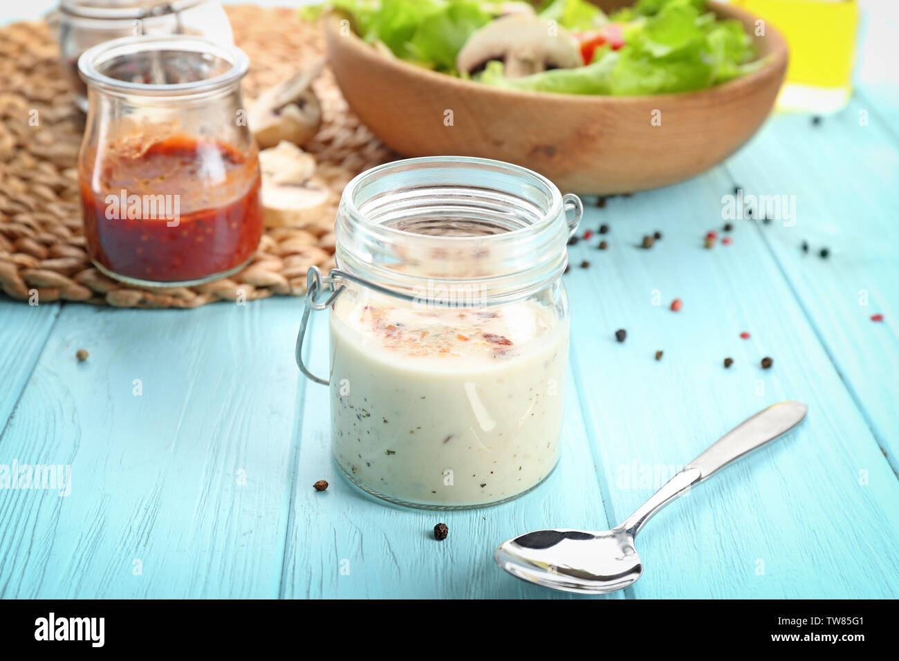 Glass jar with ranch salad dressing on table Stock Photo - Alamy