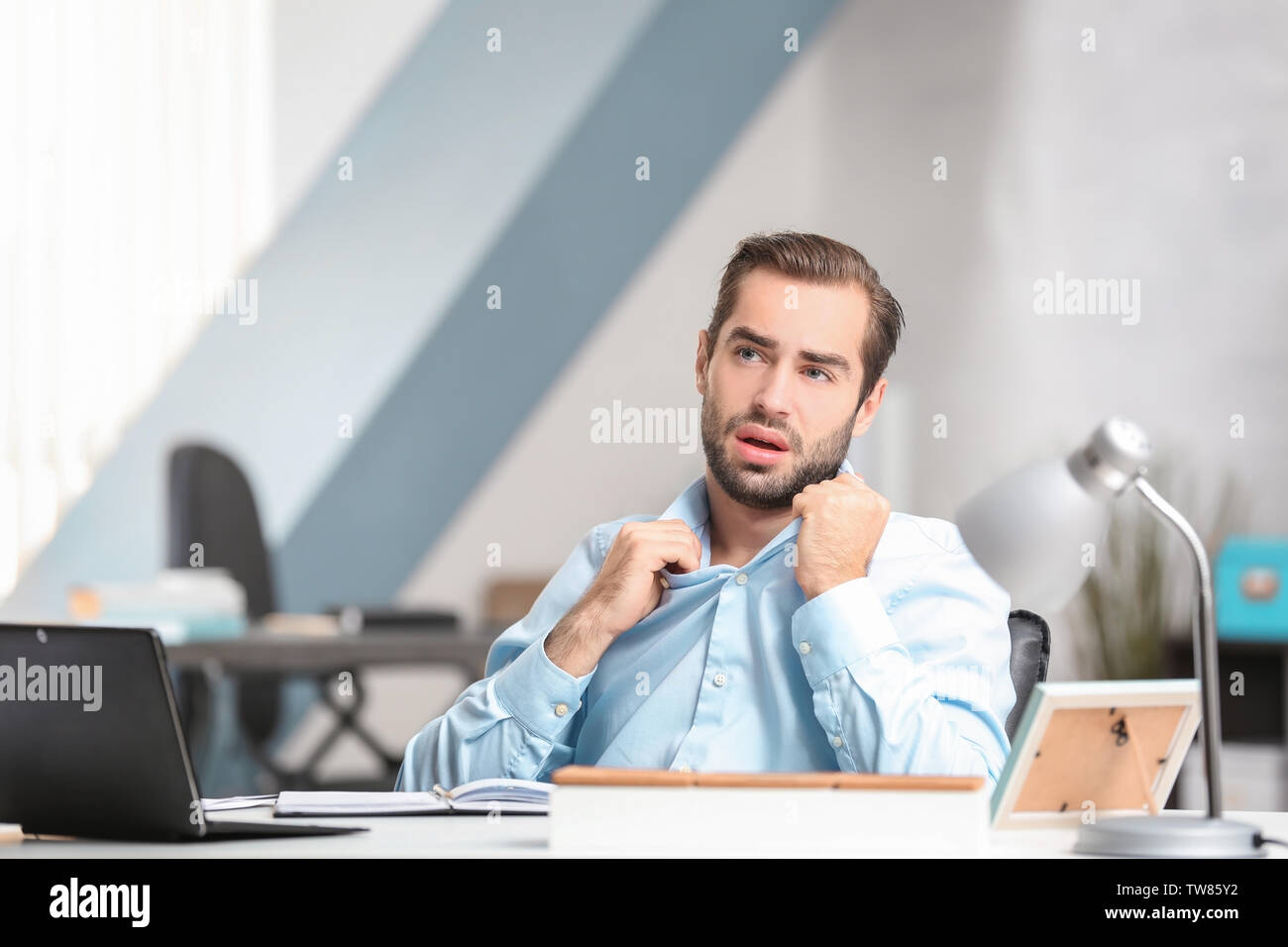 Businessman suffering from heat hi-res stock photography and images - Alamy