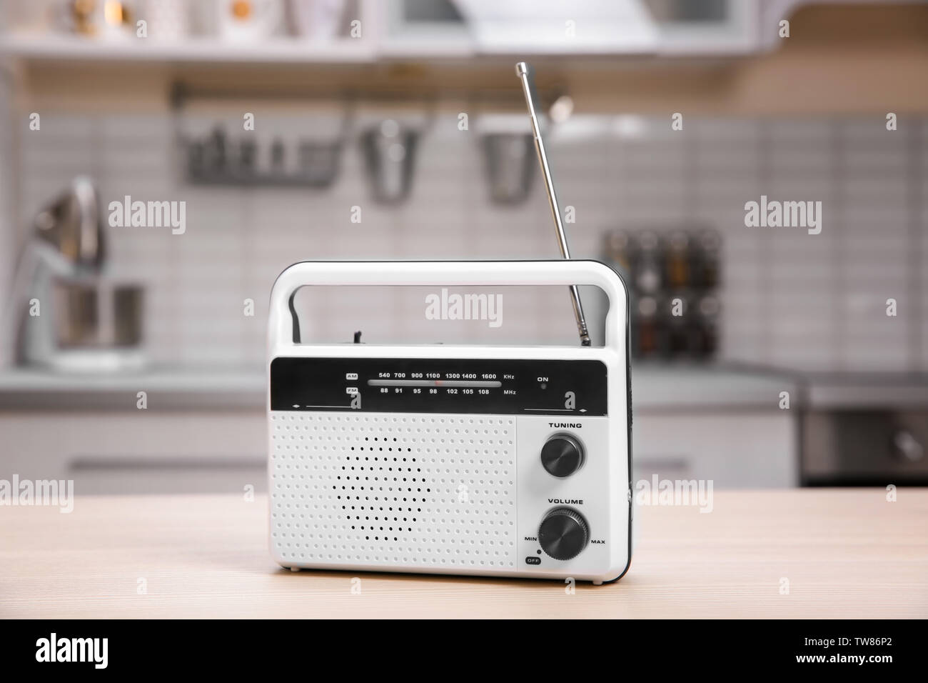 Retro style radio on table indoors Stock Photo - Alamy