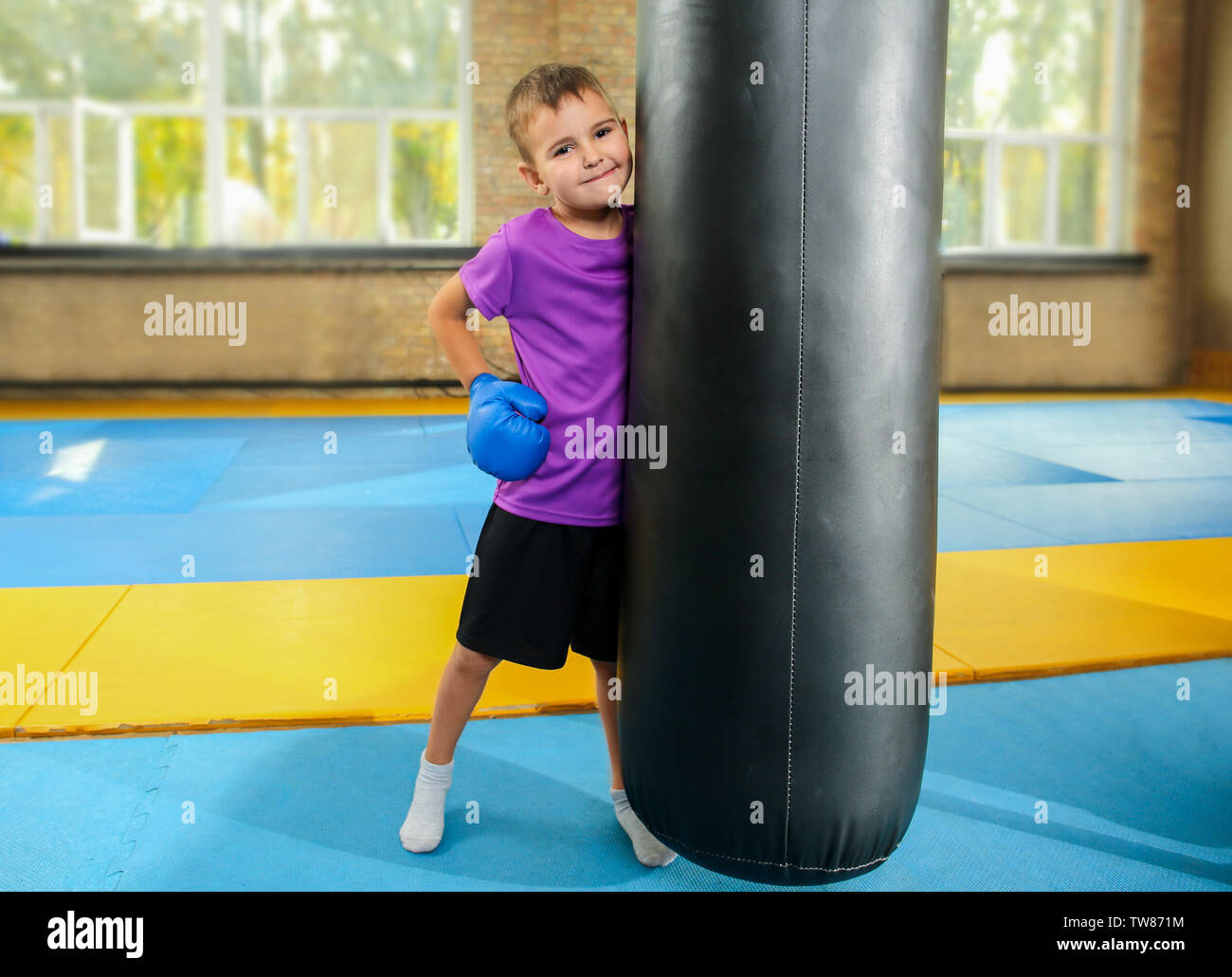 Boxing kid boy punching bag hi-res stock photography and images - Alamy