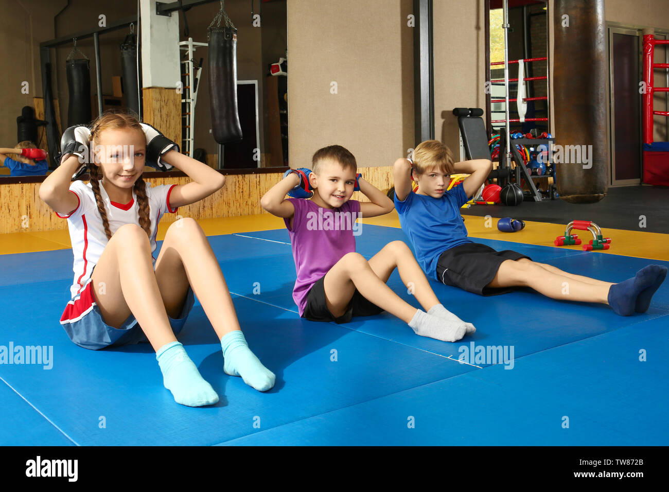 Cute little children doing exercises in gym Stock Photo - Alamy