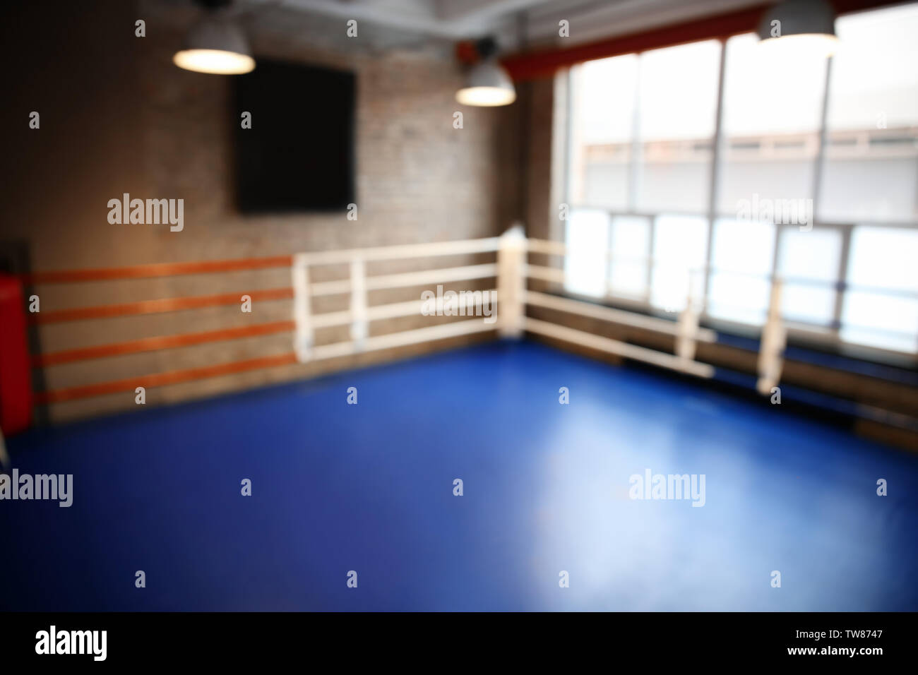 Blurred view of empty boxing ring indoors Stock Photo - Alamy