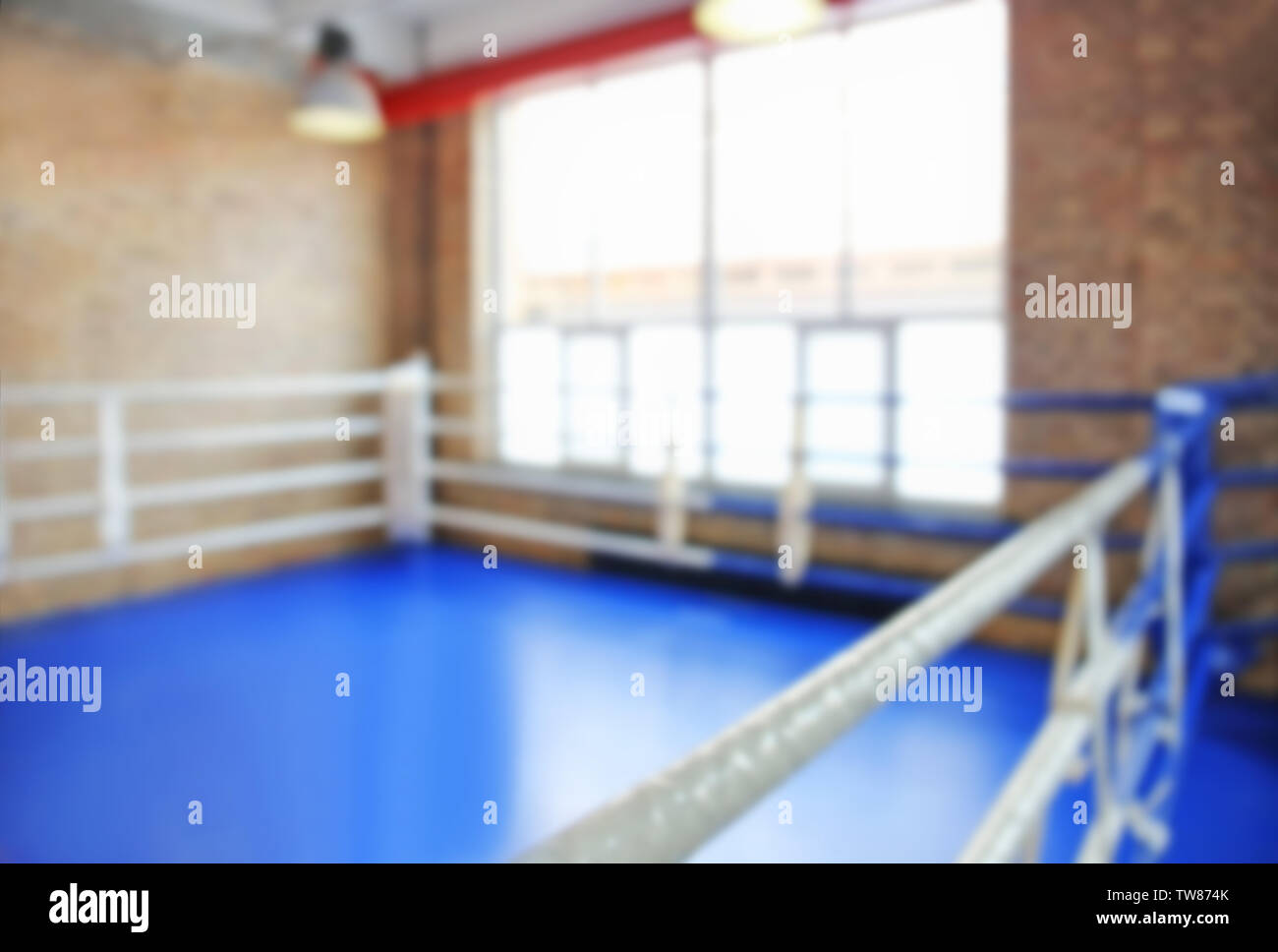 Blurred view of empty boxing ring indoors Stock Photo - Alamy