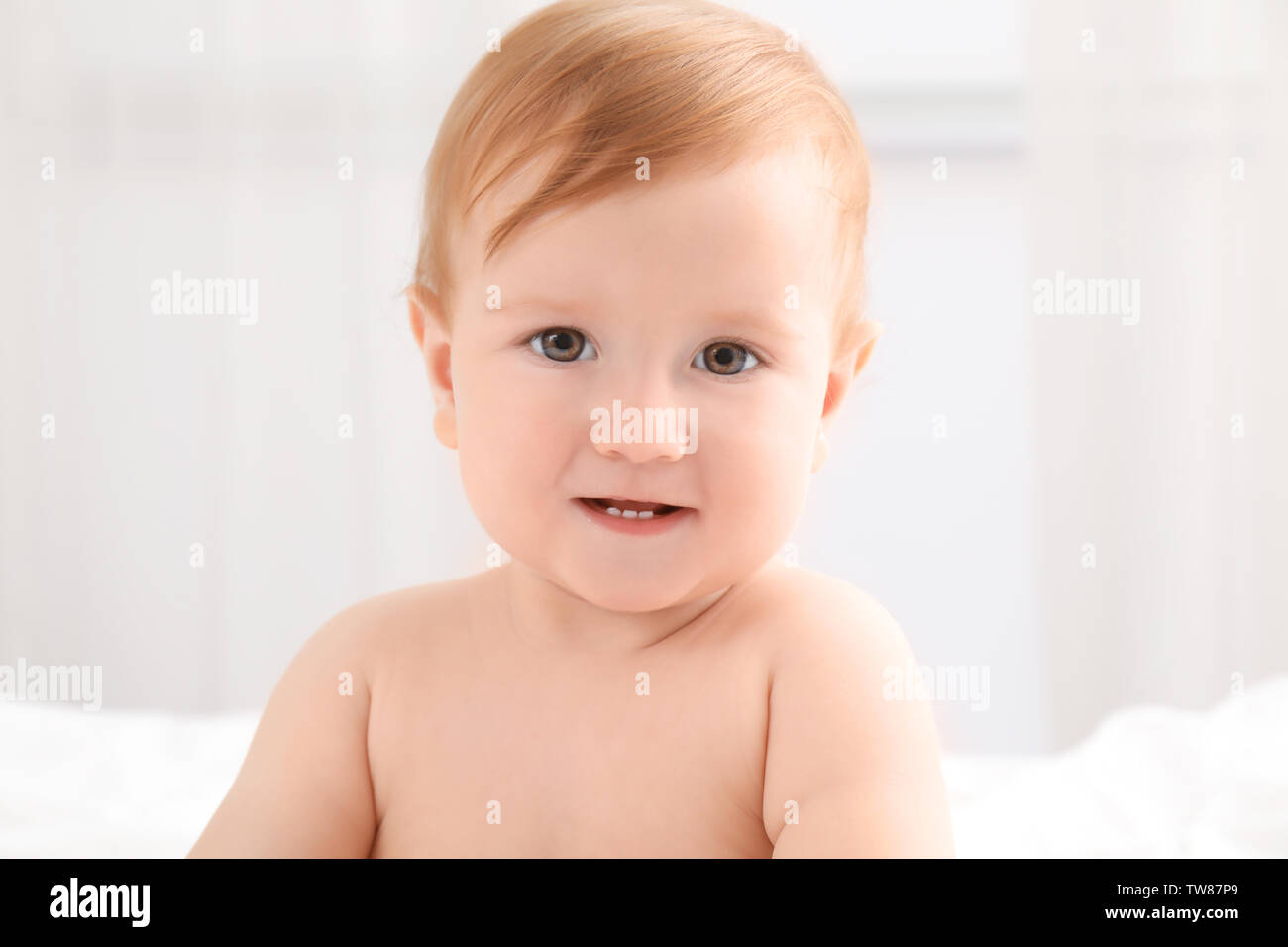 Cute little baby at home Stock Photo - Alamy