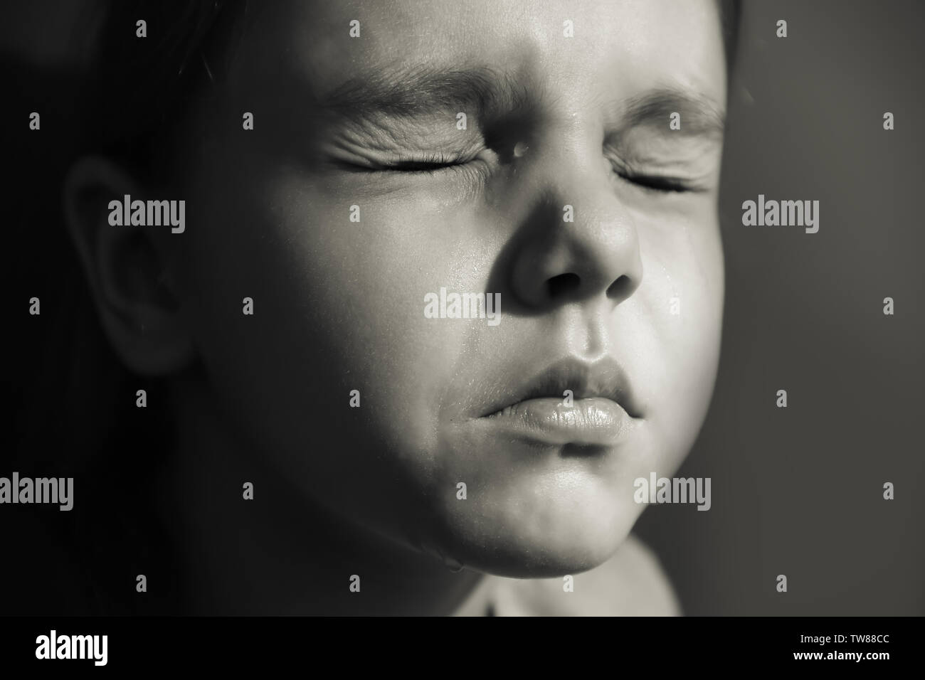 Little sad girl crying. Abuse of children concept Stock Photo - Alamy