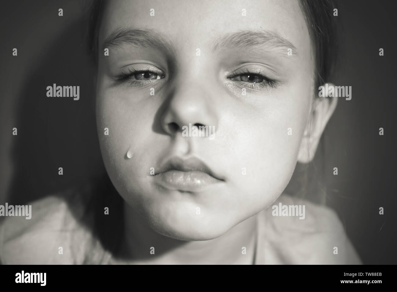 Little sad girl crying. Abuse of children concept Stock Photo - Alamy
