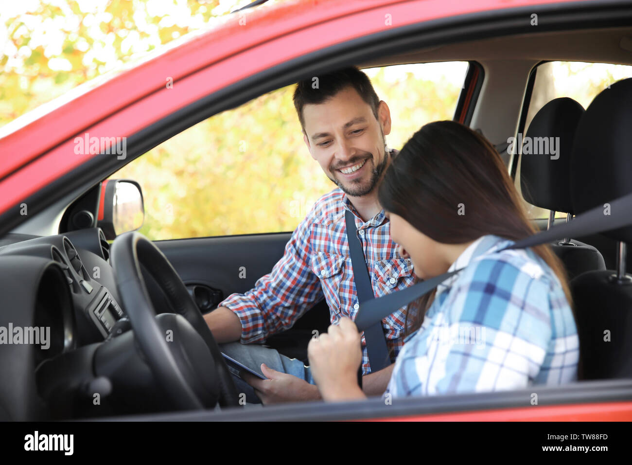 Young woman passing driving license exam Stock Photo - Alamy