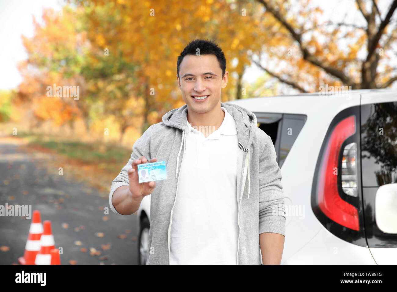 Man holding driving license hi-res stock photography and images - Alamy