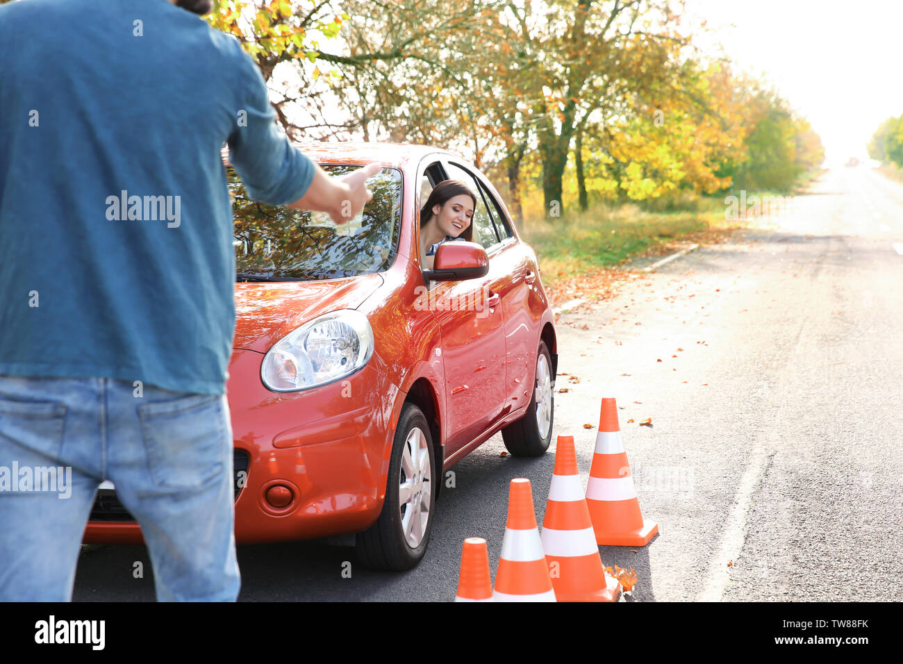 Young woman passing driving license exam Stock Photo - Alamy