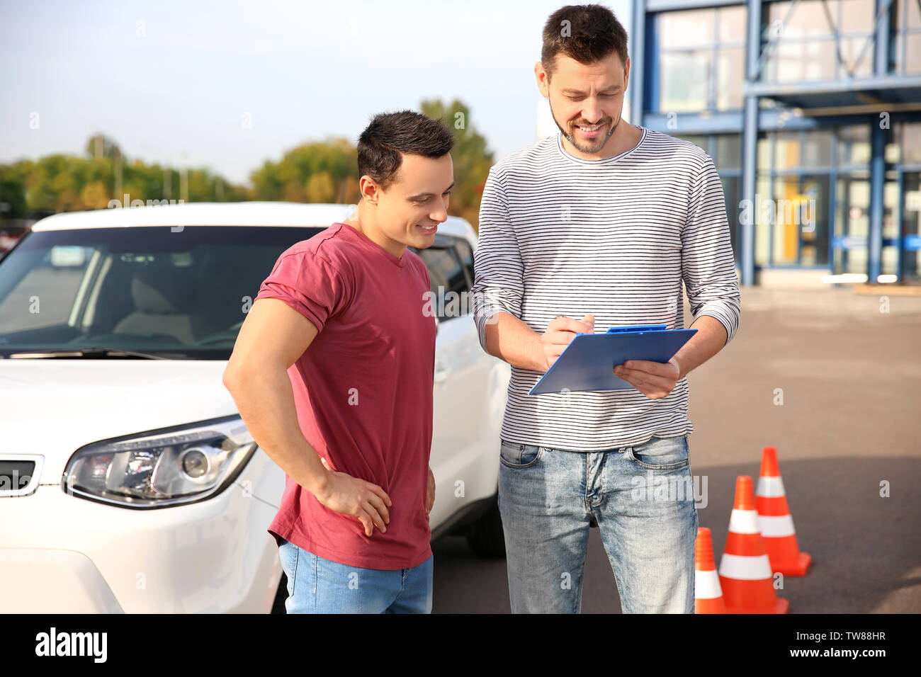 Young trainee standing outdoors hi-res stock photography and images - Alamy