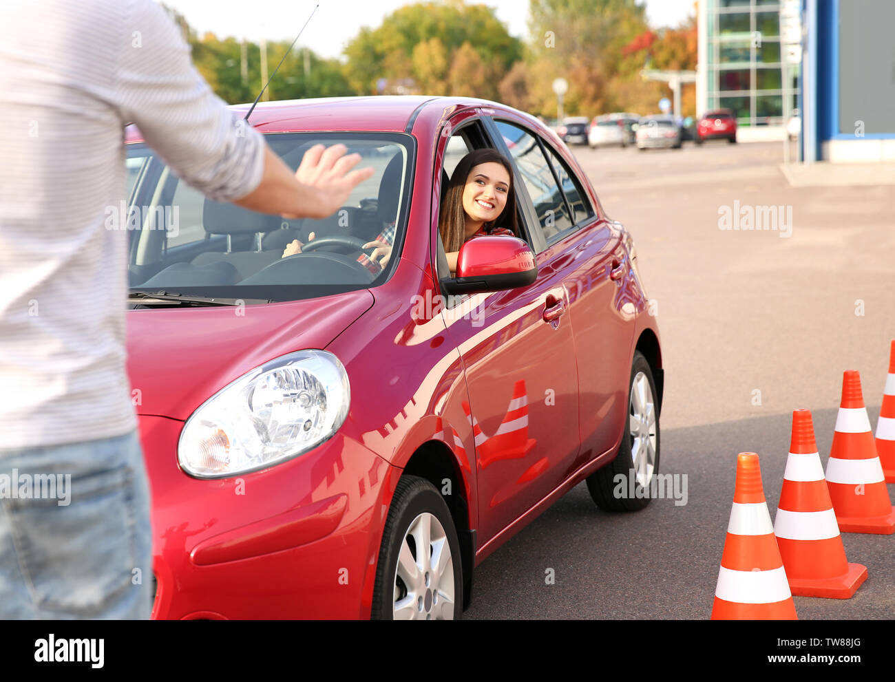 Young woman passing driving license exam Stock Photo - Alamy