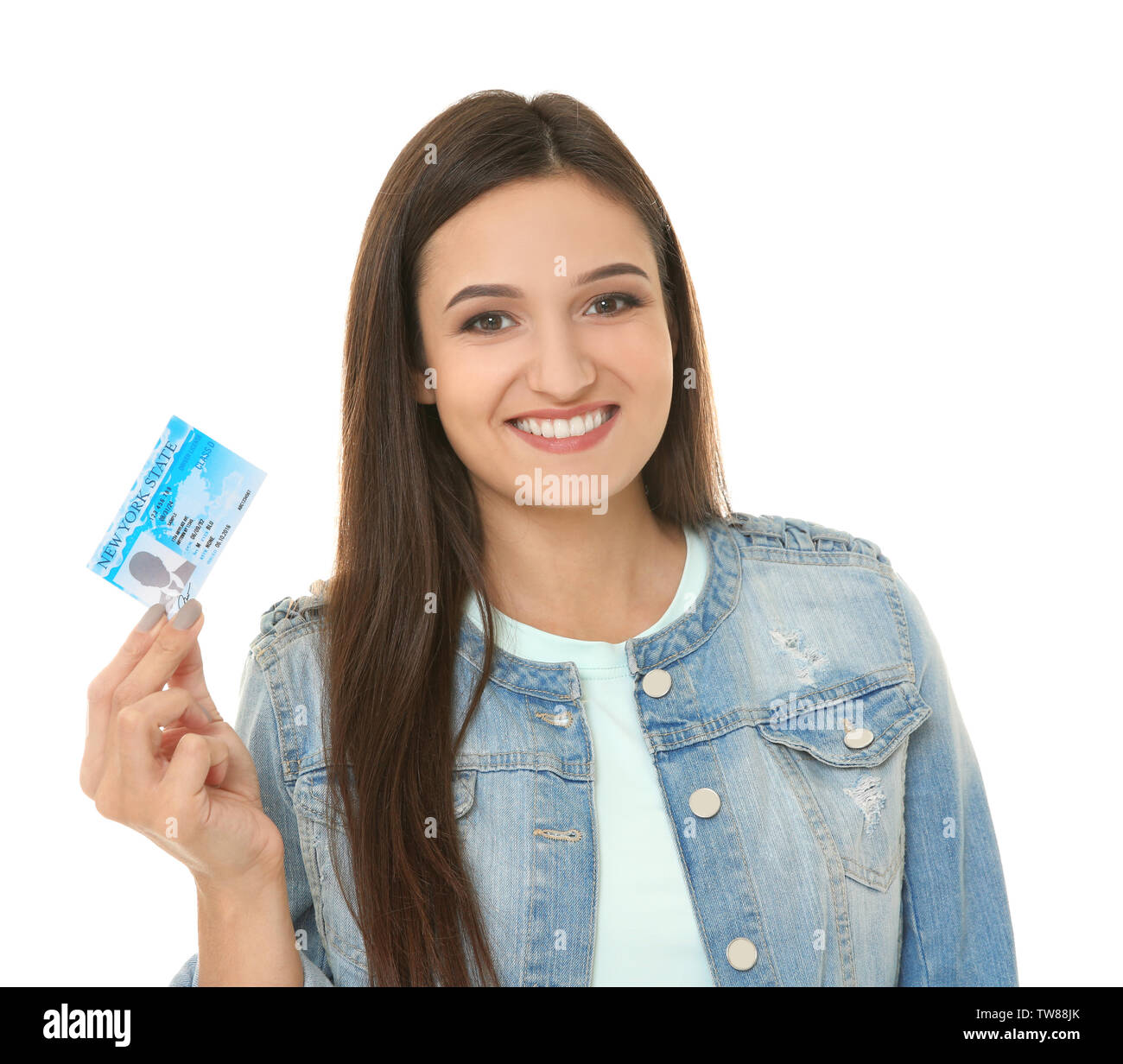 Young woman holding driving license on white background Stock Photo - Alamy