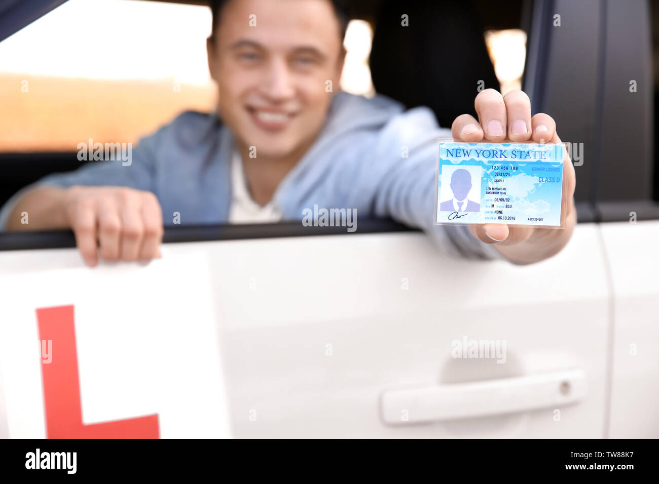Man holding driving license hi-res stock photography and images - Alamy