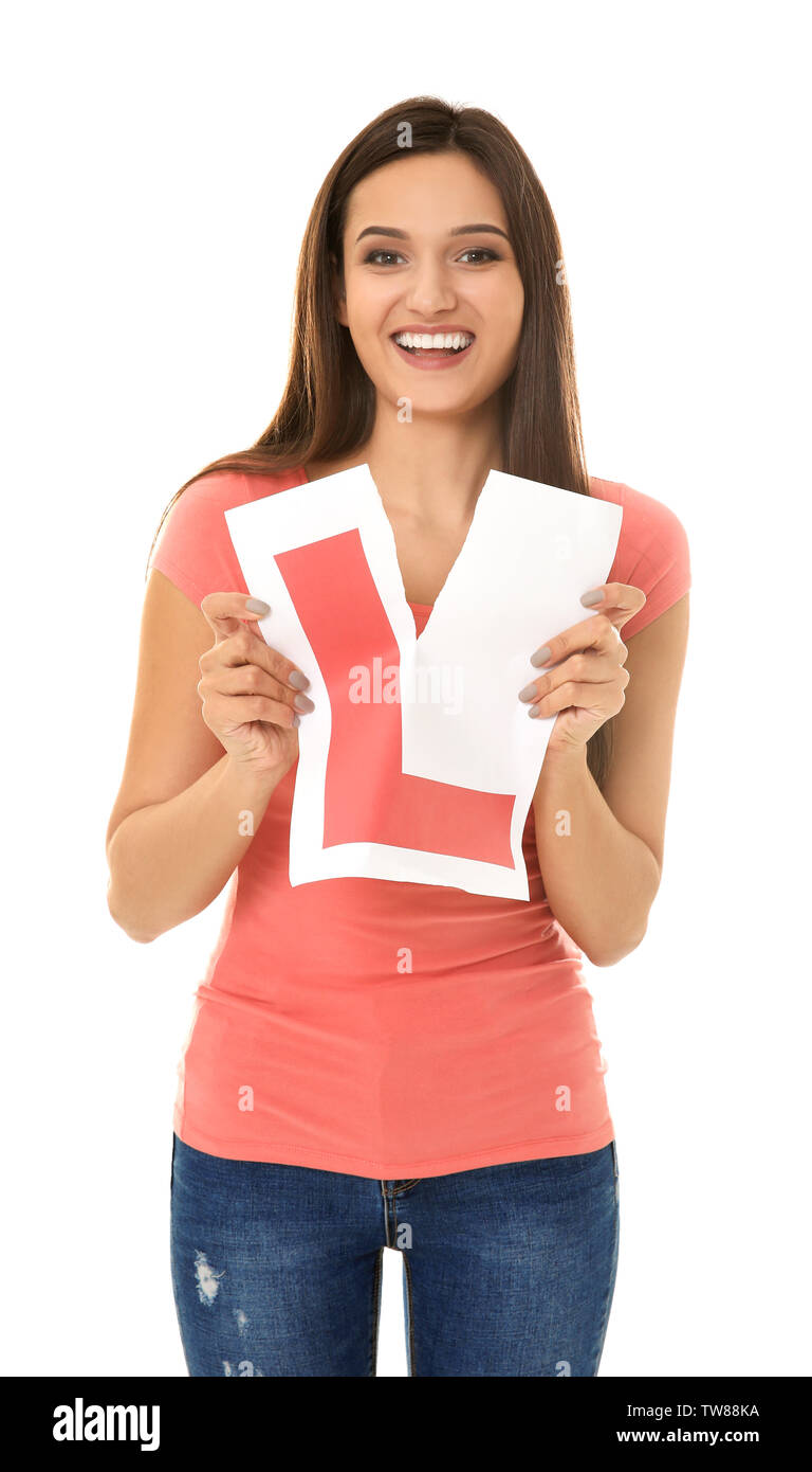 Young woman tearing learner driver sign on white background Stock Photo ...