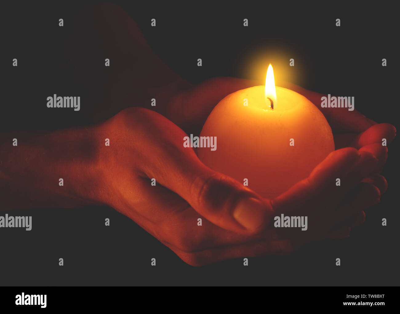 Man lit candle light in hi-res stock photography and images - Alamy