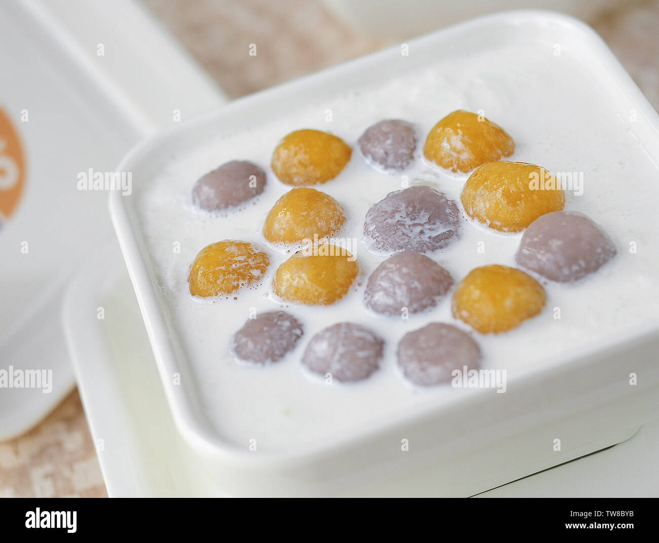 Fresh milk taro round desserts Stock Photo - Alamy