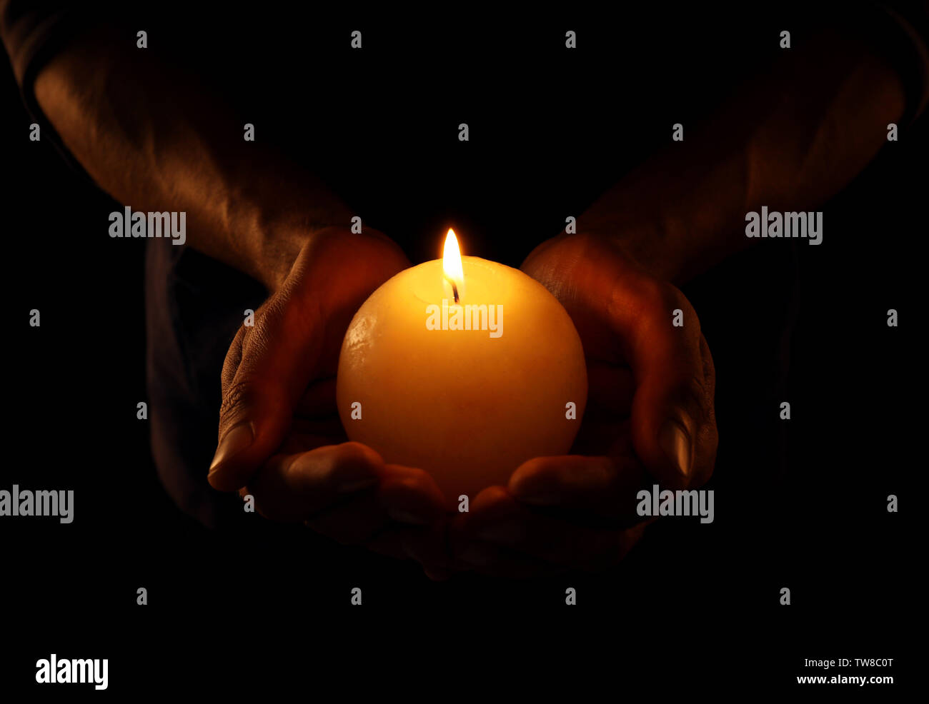 Man lit candle light in hi-res stock photography and images - Alamy