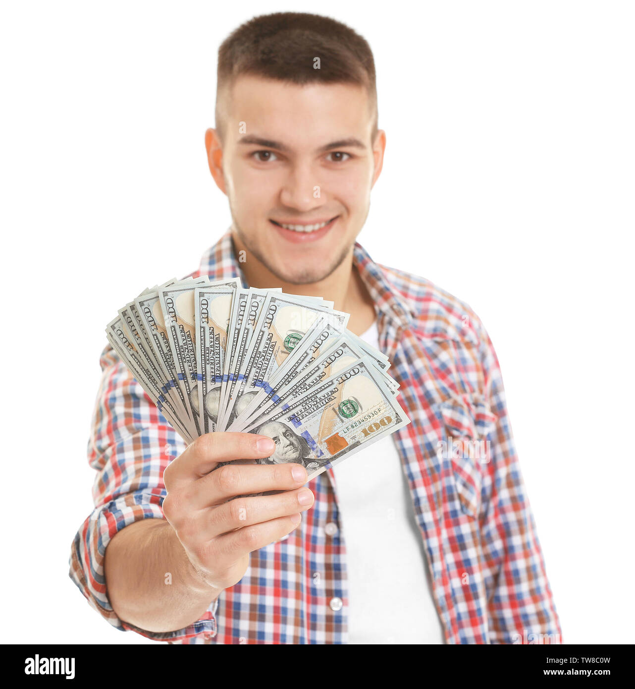 Happy young man with money on white background Stock Photo - Alamy