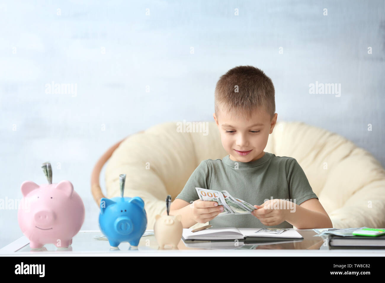 Boy Counting Money Table High Resolution Stock Photography and Images ...