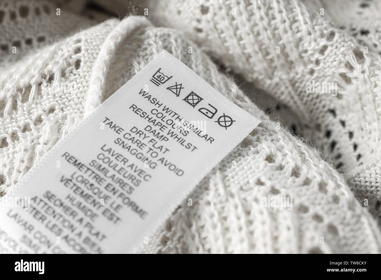 Clothing label with laundry instructions, closeup Stock Photo - Alamy