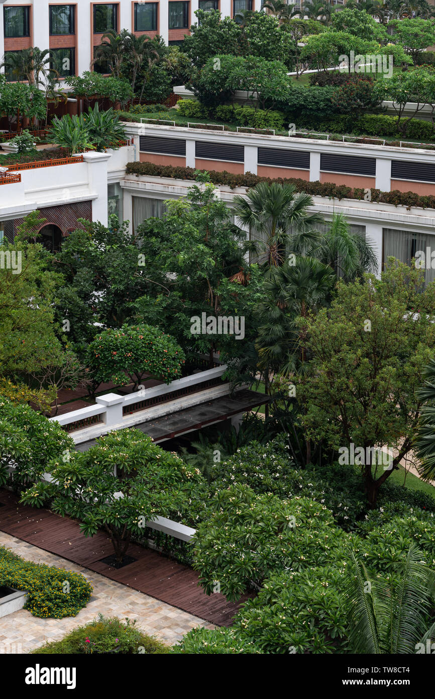 Greenery garden in luxury hotel building walkway Stock Photo - Alamy