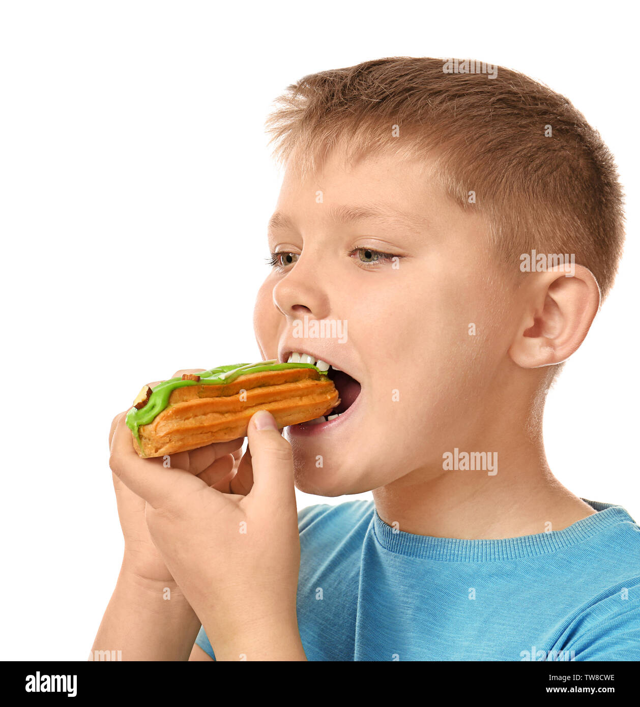 Overweight boy eating eclair on white background Stock Photo - Alamy