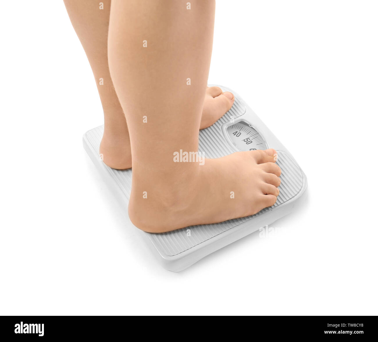 Legs of overweight boy using scales on white background Stock Photo - Alamy
