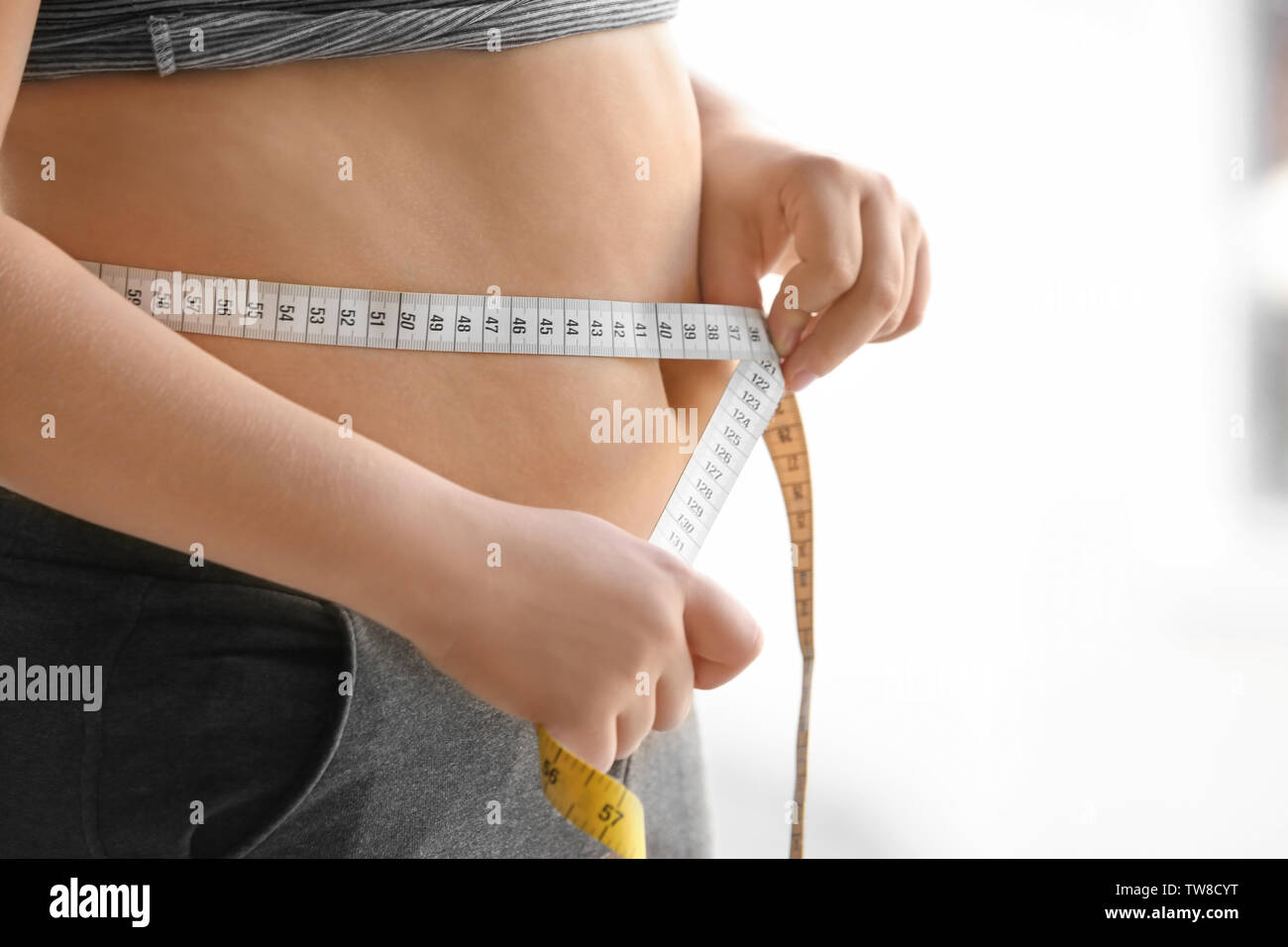 Overweight boy measuring hi-res stock photography and images - Alamy