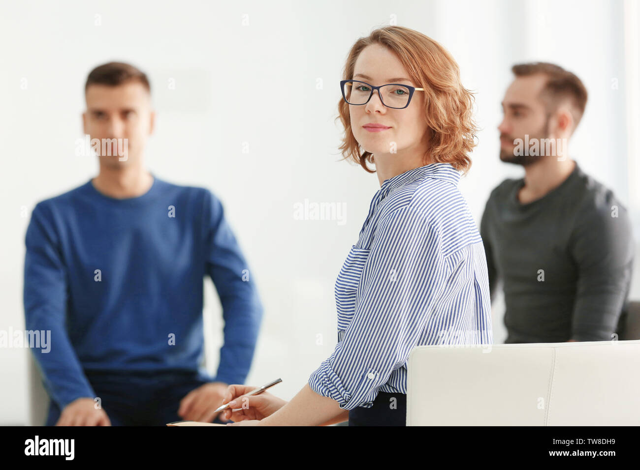 Female psychologist at group psychotherapy session indoors Stock Photo ...