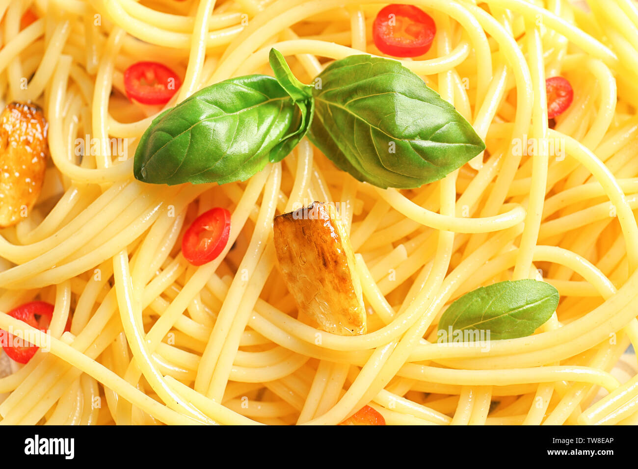 Delicious pasta with garlic and chili pepper, closeup Stock Photo - Alamy
