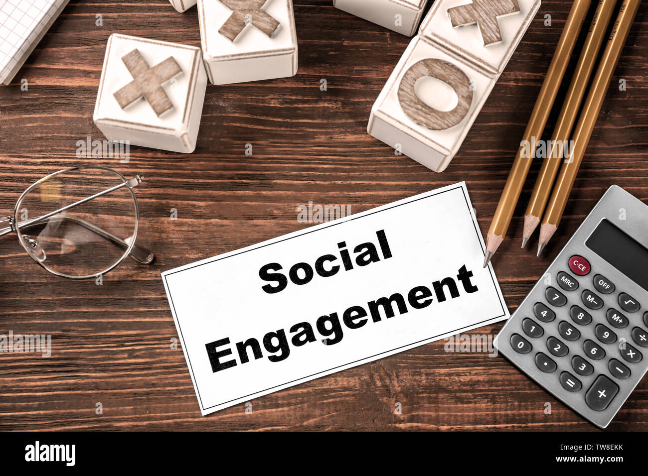 Sheet of paper with text SOCIAL ENGAGEMENT on office table Stock Photo ...