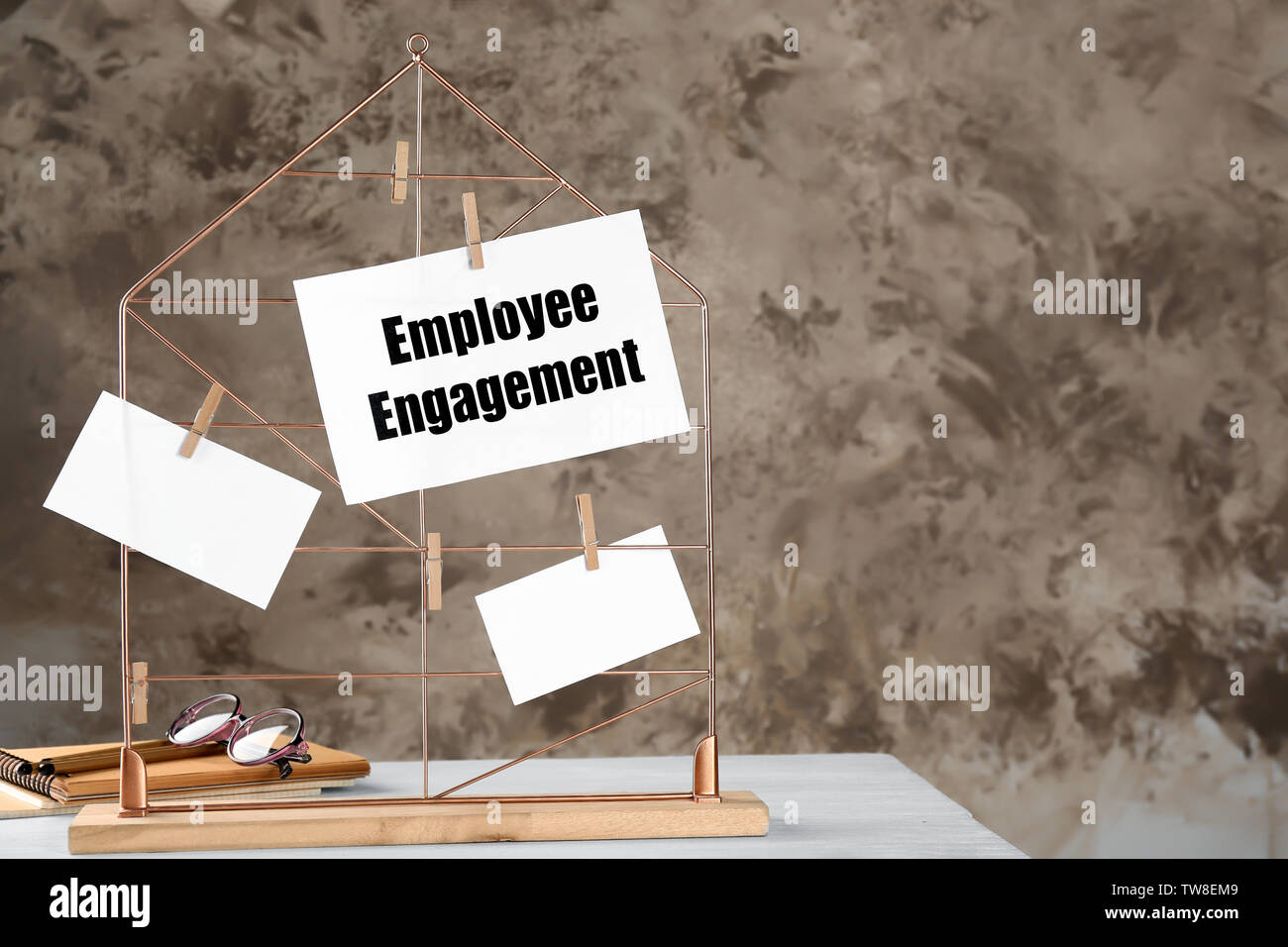 Sheet of paper with text EMPLOYEE ENGAGEMENT on decorative house Stock ...