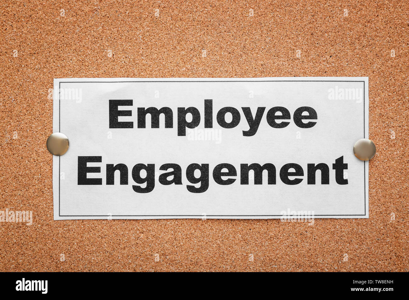 Sheet of paper with text EMPLOYEE ENGAGEMENT on cork background Stock ...