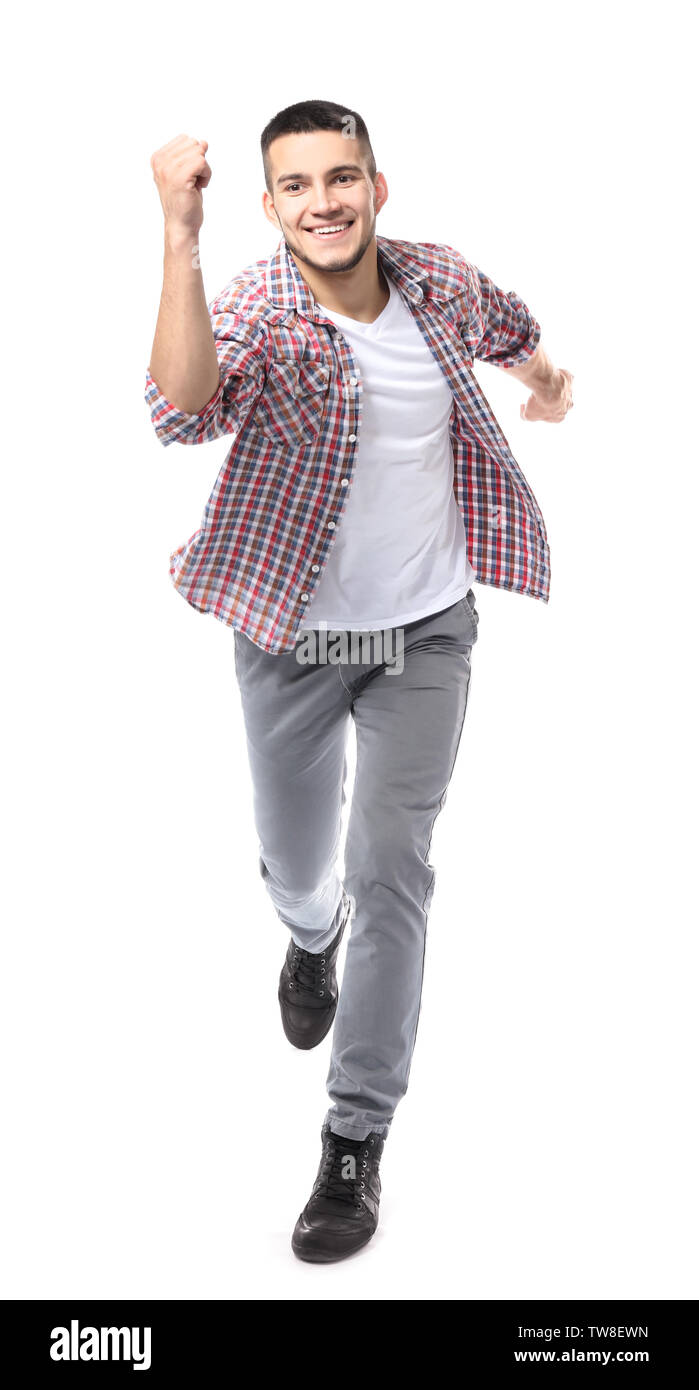 Young man in casual clothes running against white background Stock ...