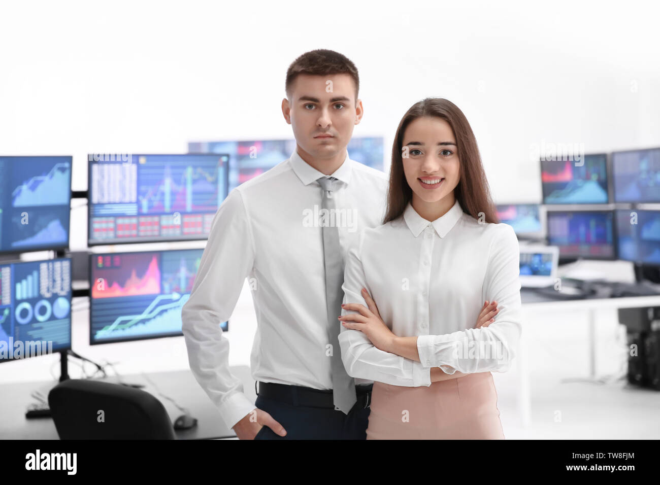 Stock traders working in office Stock Photo - Alamy