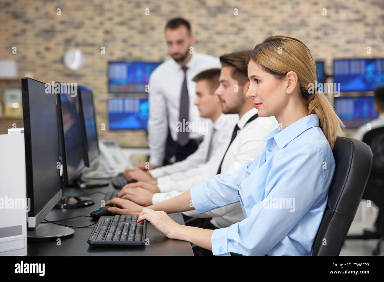 Stock traders working in office Stock Photo - Alamy