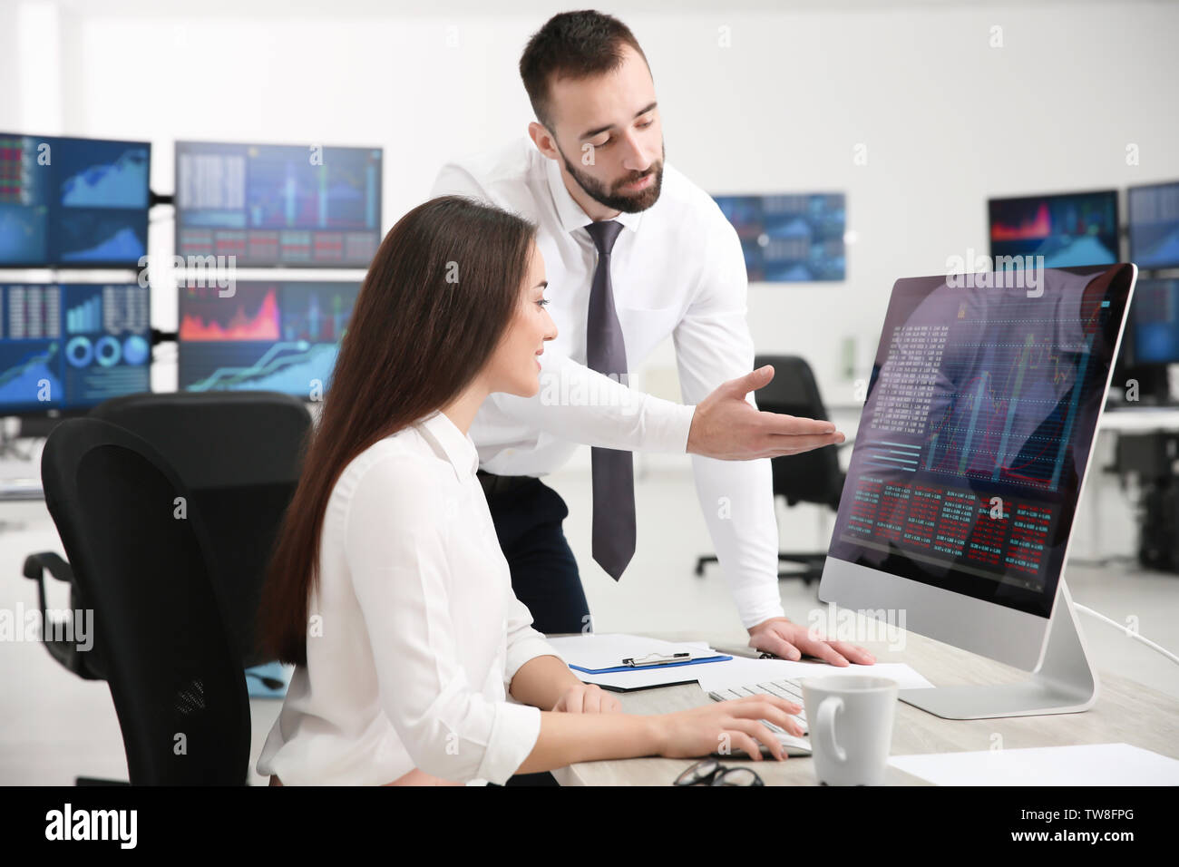 Stock traders working in office Stock Photo - Alamy