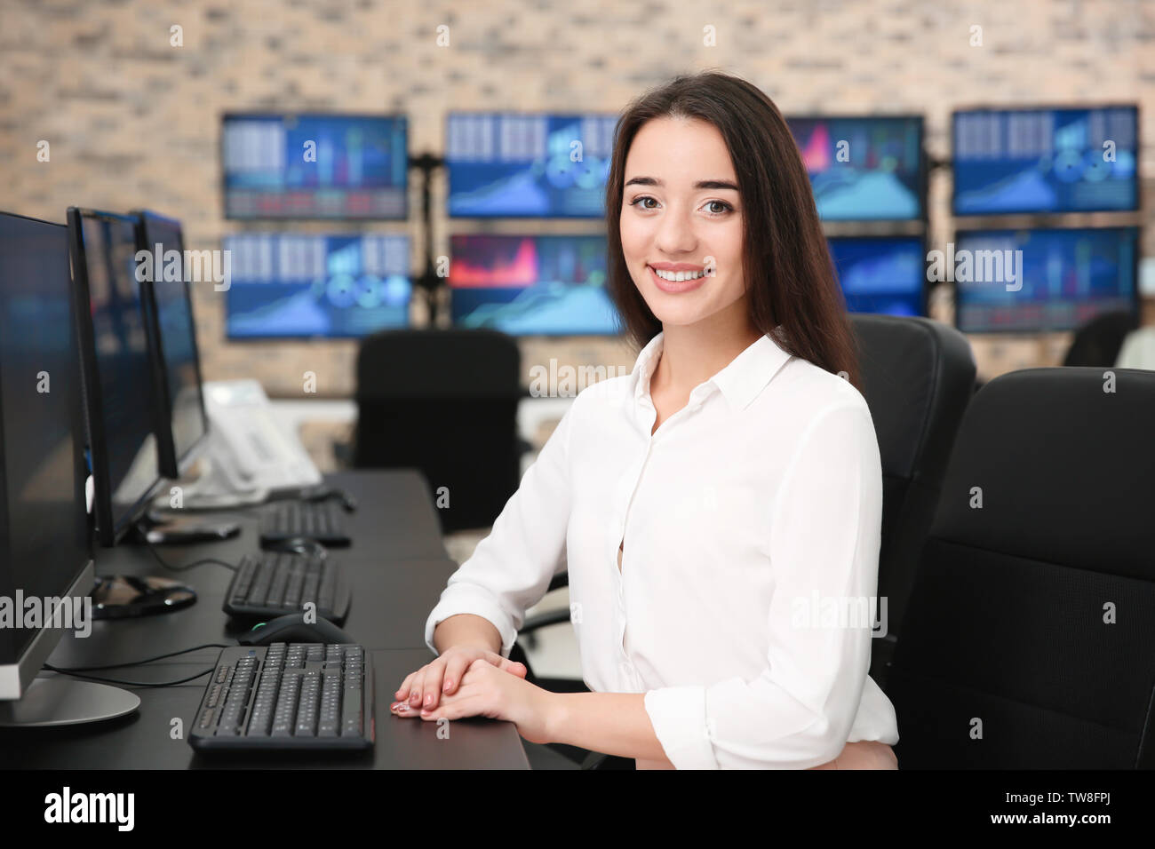 Female financial trader working in hi-res stock photography and images ...