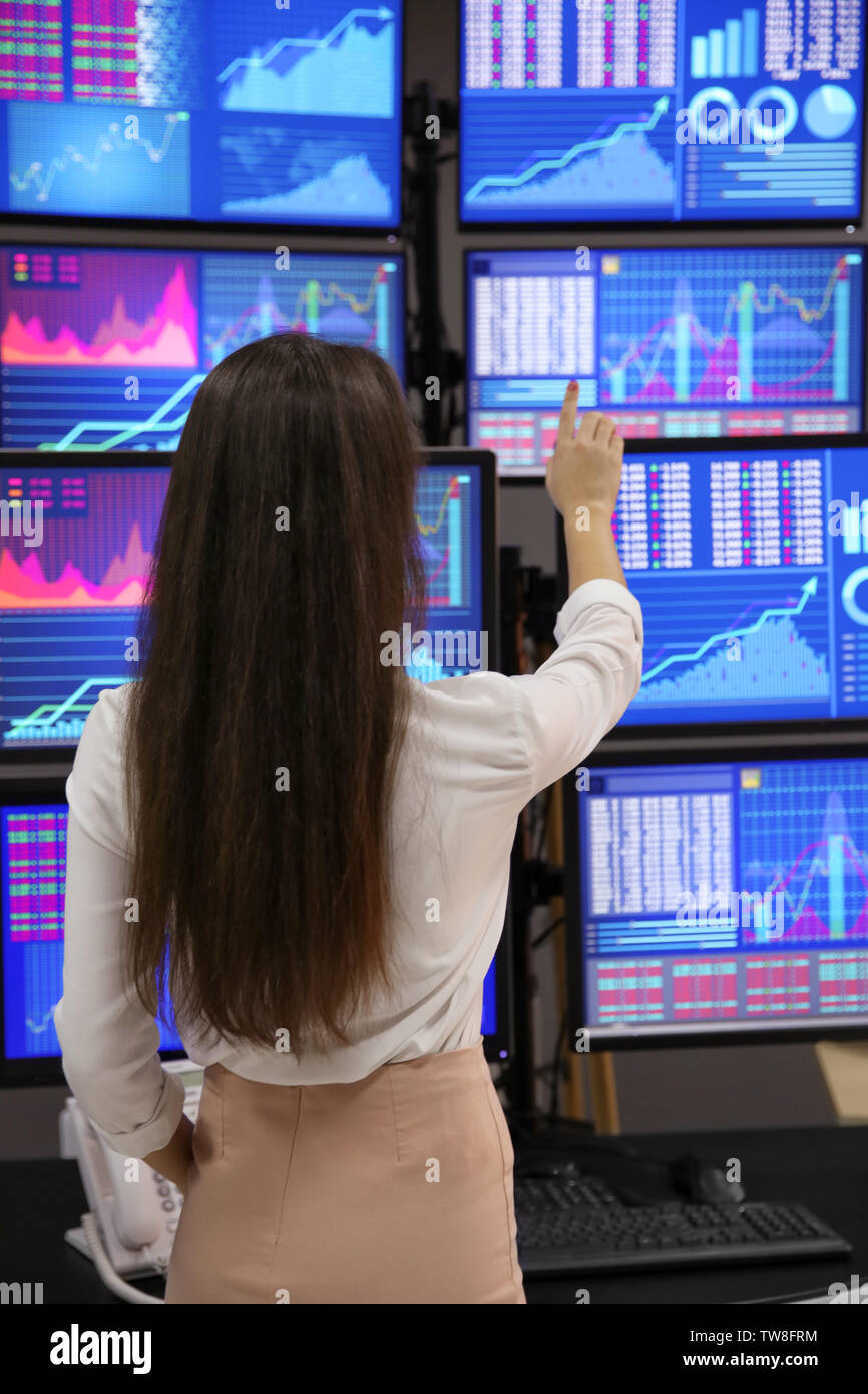 Female financial trader working in hi-res stock photography and images ...
