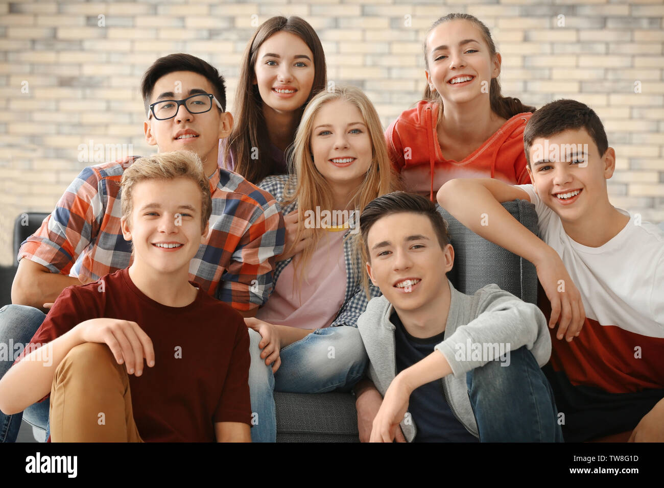 Group of funny teenagers indoors Stock Photo - Alamy